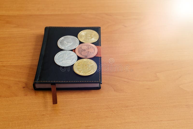 Coins of Electronic Money are on a Notebook Stock Image - Image of ...