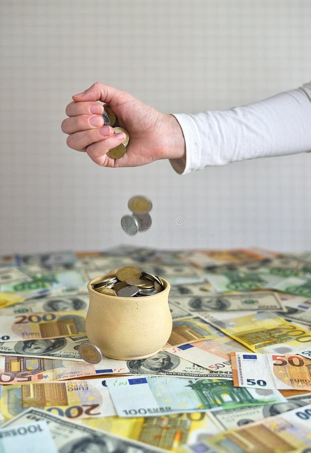 Coins are Falling in the Cup Stock Image - Image of economy, banking ...