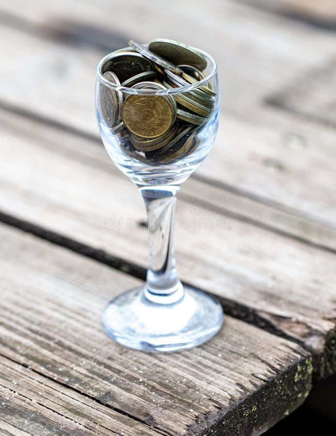 Coins in a Glass Cup on a Wooden Board Stock Image - Image of saving ...