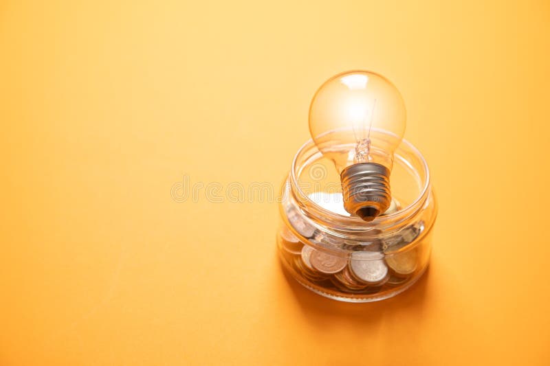 Coins with a Glowing Light Bulb Stock Illustration - Illustration of ...