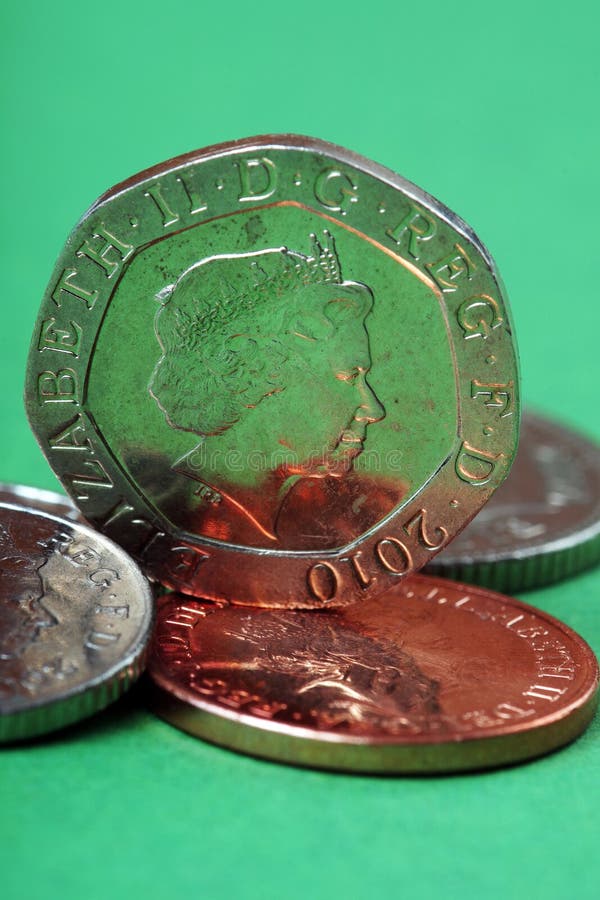 Coins of Great Britain on a Green Background Close-up. British Coins ...