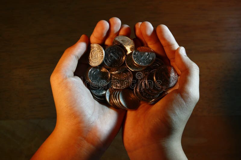 Coins in Hand stock image. Image of hands, holding, giving - 22597835