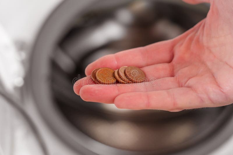 Coins in Hand in Laundry Closeup. Commercial Routine Stock Photo ...
