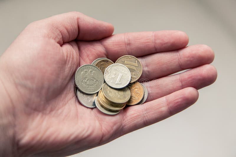 Coins in hand stock image. Image of wealth, large, metal - 66981899
