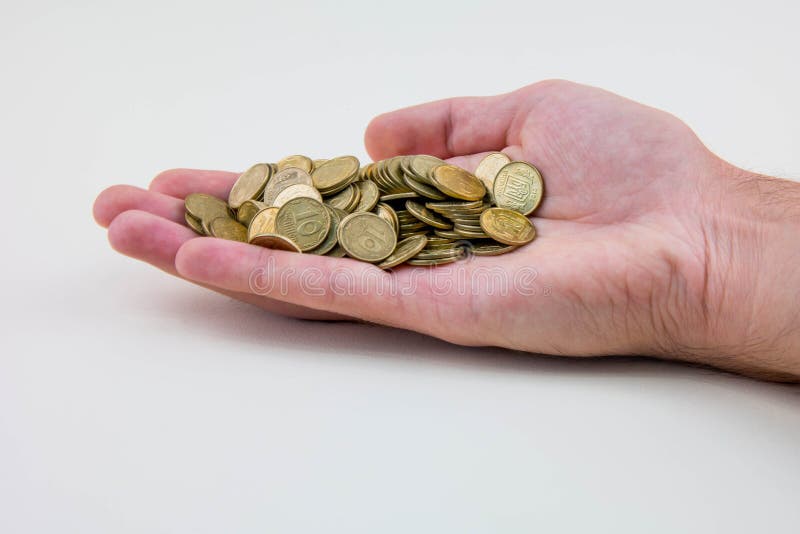 Coins in hand stock photo. Image of heap, hand, human - 44607116