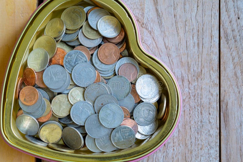 Coins in heart stock photo. Image of purchasing, currency - 58796674