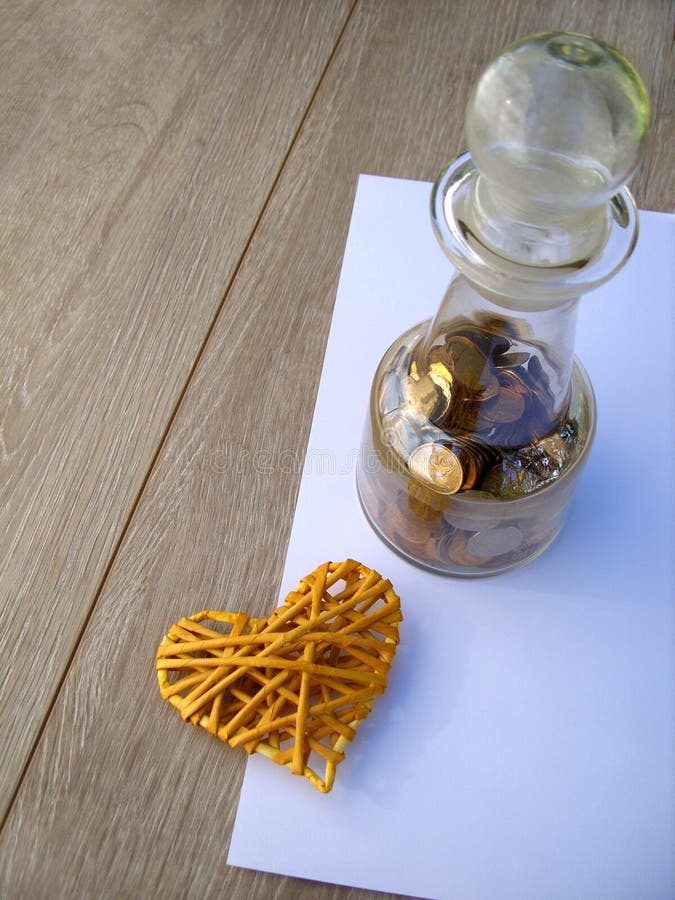 Coins and a Heart on a Wooden Table Stock Image - Image of love, coins ...