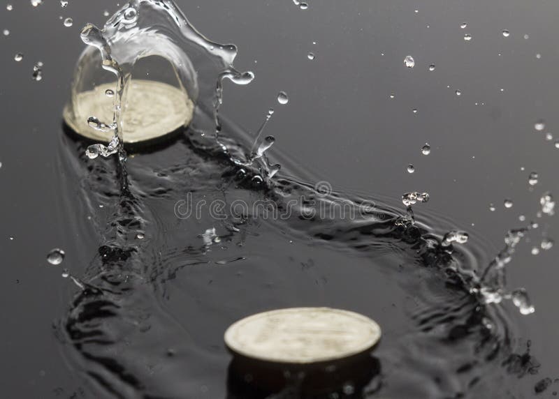 Coins jumping on water stock photo. Image of falling - 124798110