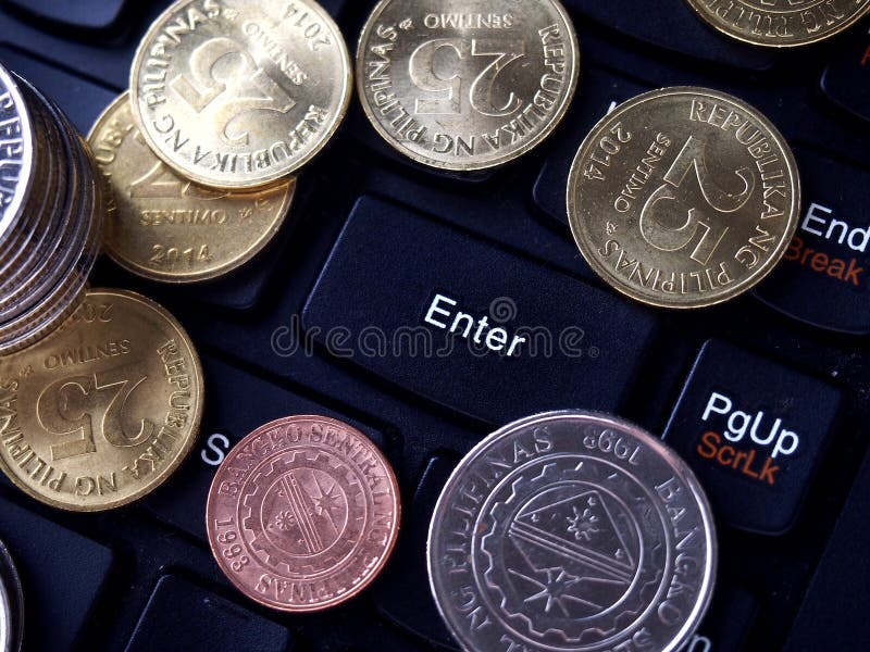 Coins on the Keyboard of a Laptop Computer Stock Image - Image of ...