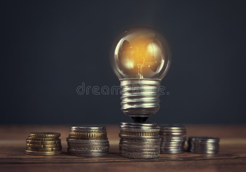 Coins with light bulb stock image. Image of plan, development - 196362137