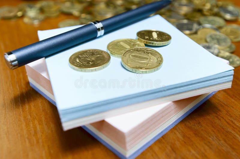 Coins, pen and paper stock photo. Image of bunch, coins - 66557578