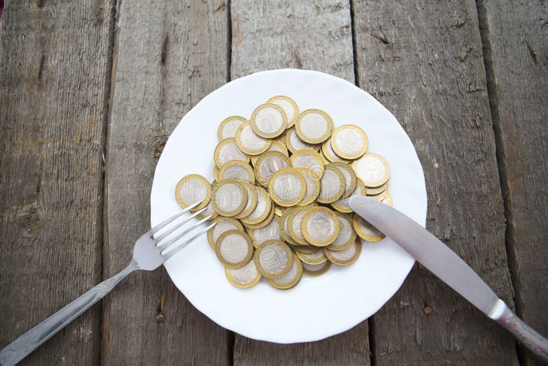 Coins on a plate stock image. Image of paying, money - 233880721