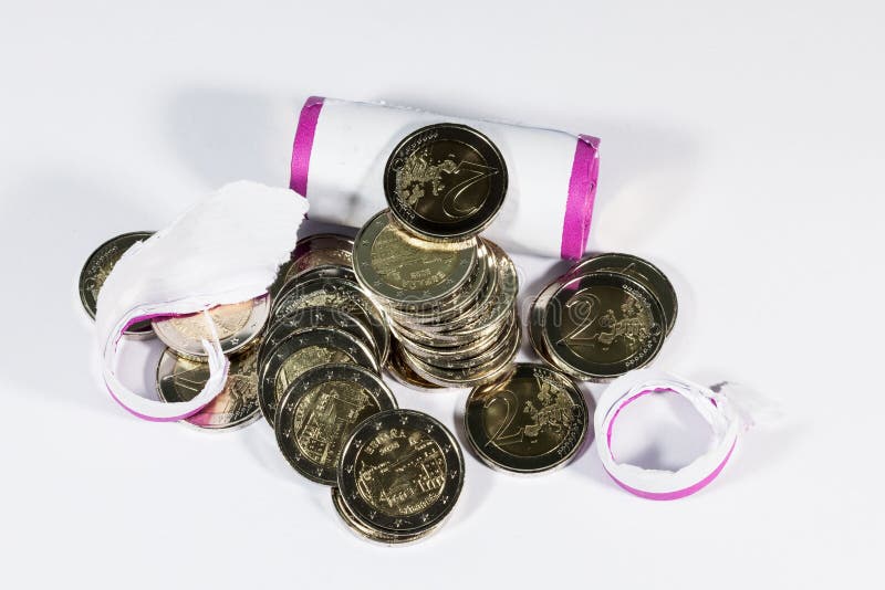 Coins and a Roll of Paper are Arranged Together on a Table Stock Photo ...