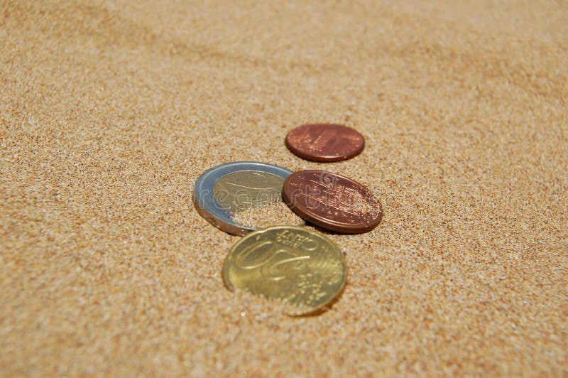Coins in sand stock photo. Image of cents, metal, sink - 10959252