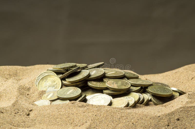Coins in sand stock photo. Image of cents, metal, sink - 10959252