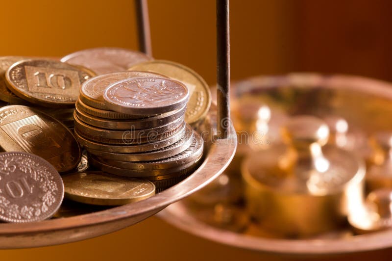 Coins on a scale weight stock image. Image of finance - 21804003