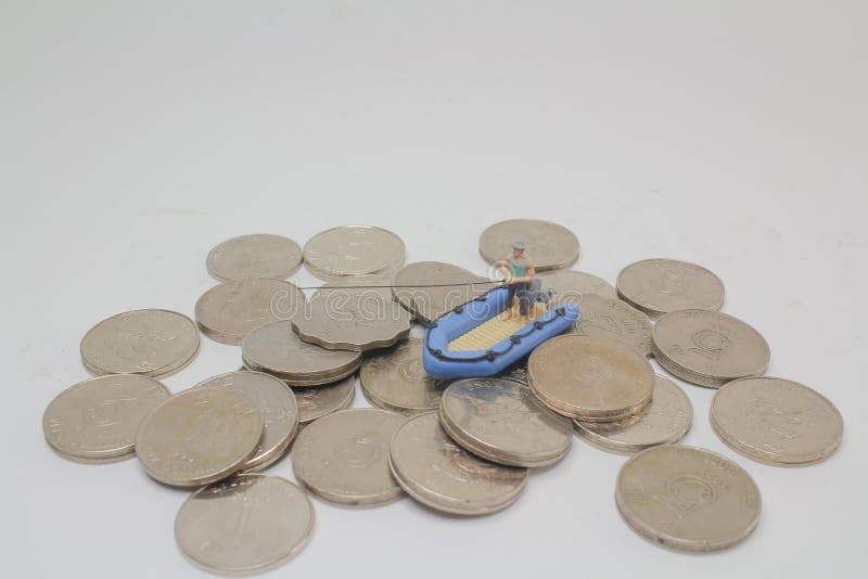 A Mini Figure on Coins Stack and Catching Coins Stock Image - Image of ...