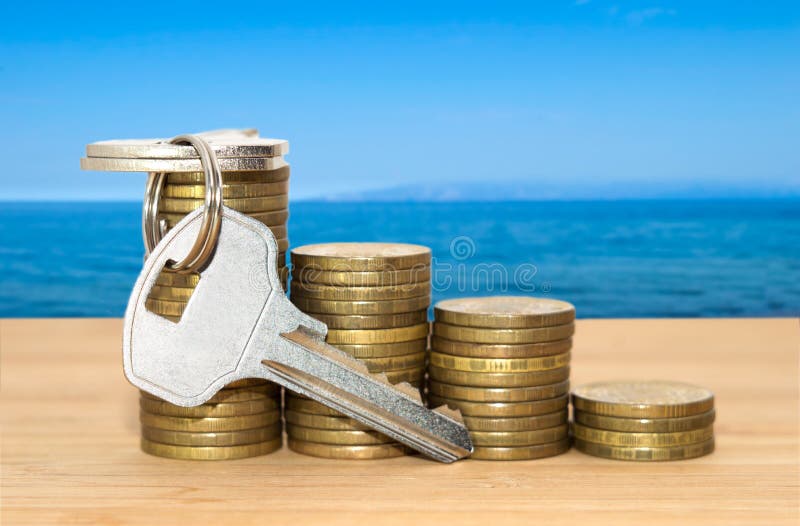 Coins stack with keys stock photo. Image of business - 104723730