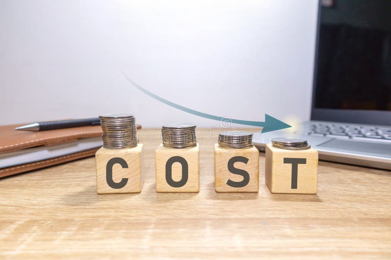 Coins Stacking with the Down Arrow. Cost Reduction Concept Stock Photo ...