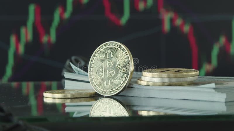 Coins with the Symbol of Bitcoin Laying on Stack of Banknotes on Graph ...