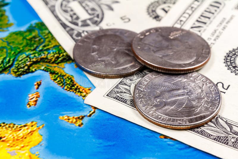 Coins with US Dollars Banknotes on the Background of Geographic Map ...