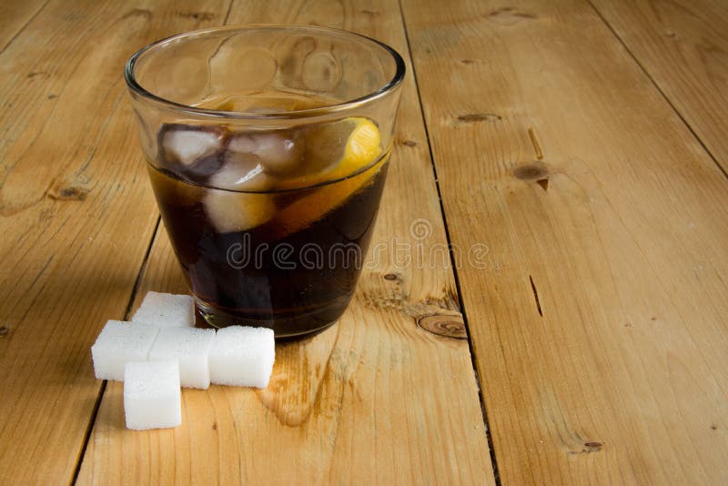 Cola with Ice and Lemon with Sugar Cube Stock Photo - Image of ...