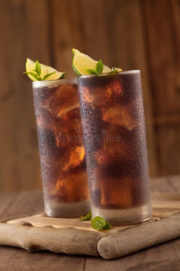 Glass of cola with ice. stock image. Image of island - 104336525