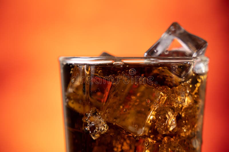 Cola with Ice Cubes Close-up. Cola with Ice and Bubbles in Glass. Stock ...