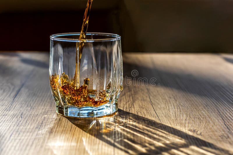 Cola is Poured into the Glass with a Splash and a Drop Stock Image ...