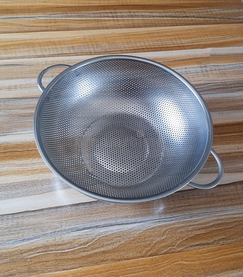 A Colander on a Wooden Table with Patterns Stock Image - Image of cook ...