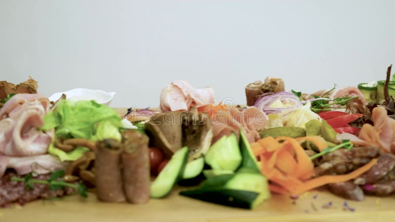 Cold Appetizer of Fresh Vegetables and Meat on the Buffet Table Stock ...