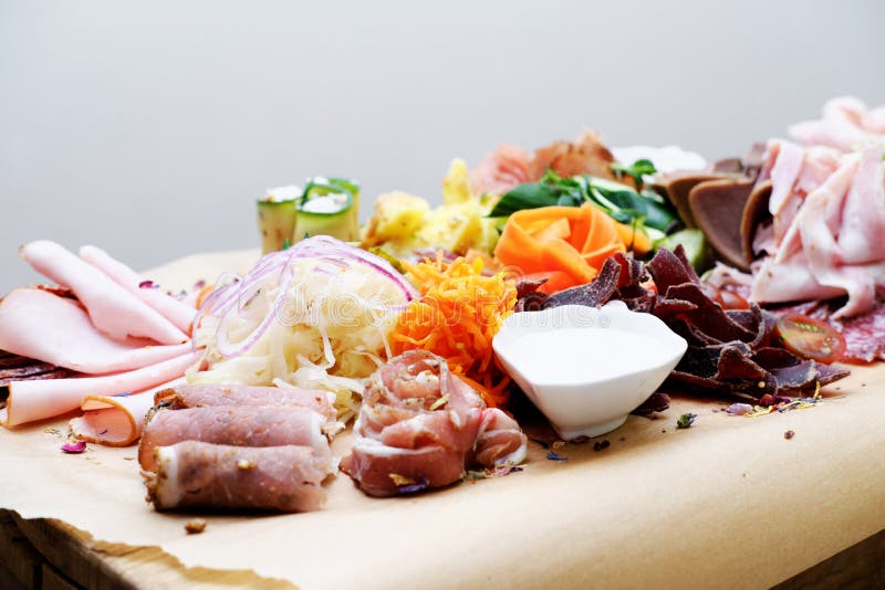 Cold Appetizer of Fresh Vegetables and Meat on the Buffet Table Stock ...