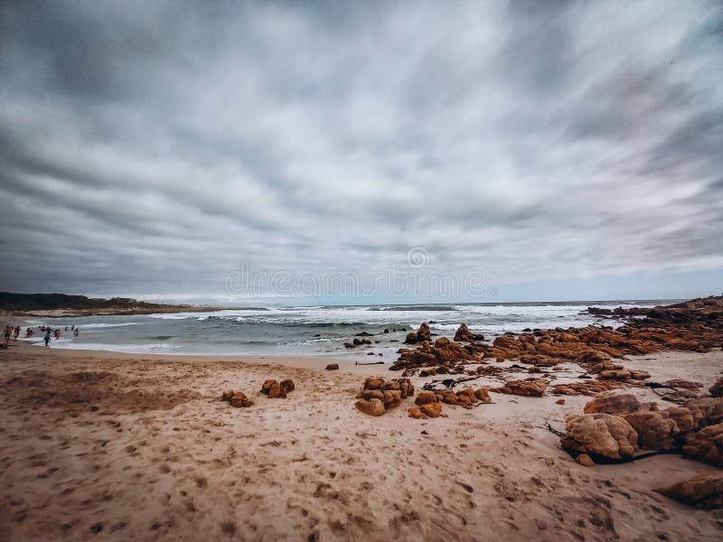 Cold Beach day stock image. Image of clouds, cold, rocks - 225729541