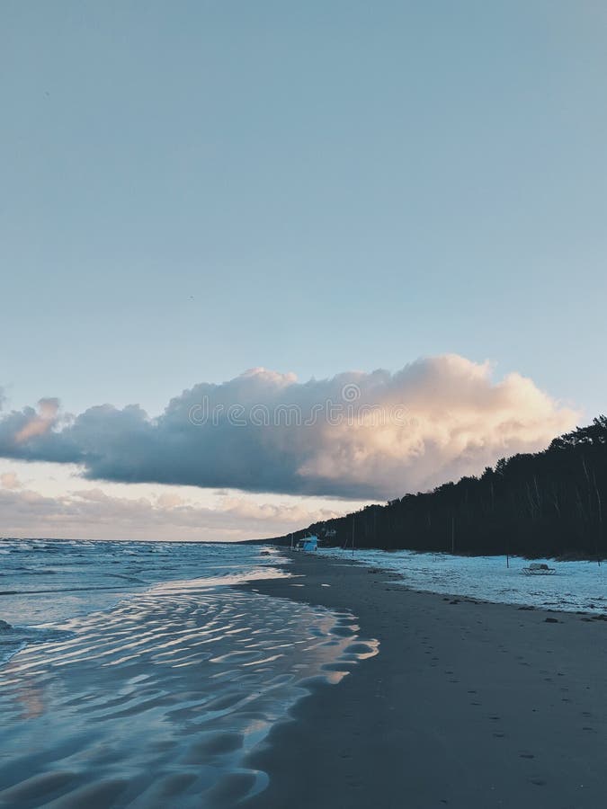 Cold beach stock image. Image of beach, waves, clouds - 107813211