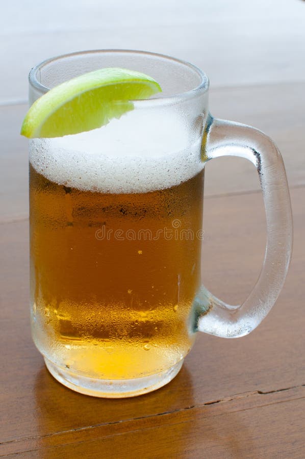 Cold beer stock image. Image of wood, yellow, alcohol - 29234057