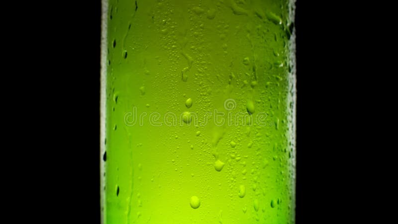 Cold Beer Bottle Dripping Condensate on Black Background Stock Footage ...
