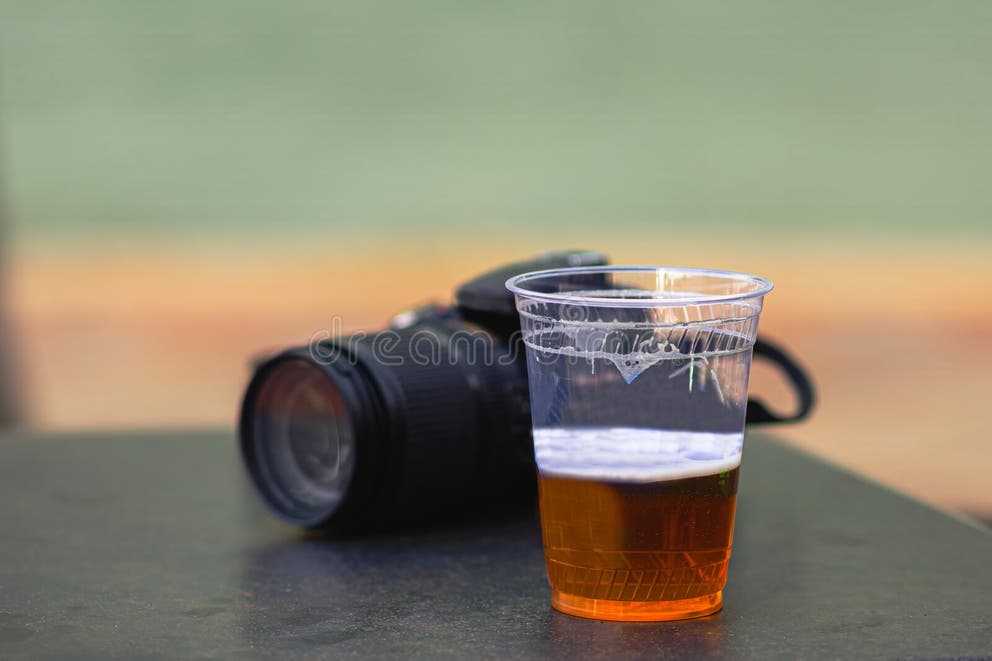 A cold beer and camera stock photo. Image of focus, lens - 305490774