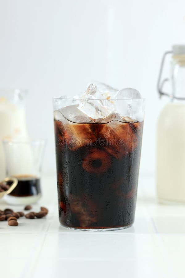 Cold Black Coffee with Ice Cubes on a White Background Stock Photo ...