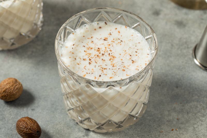 Cold Boozy Rum Milk Punch with Cream and Nutmeg Stock Photo - Image of ...