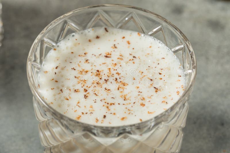 Cold Boozy Rum Milk Punch with Cream and Nutmeg Stock Photo - Image of ...