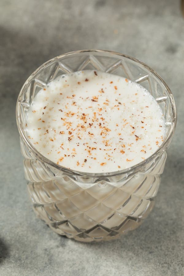 Cold Boozy Rum Milk Punch with Cream and Nutmeg Stock Photo - Image of ...