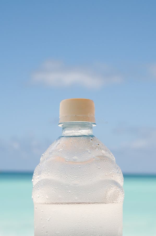 Cold Bottle of Water on Beach Stock Photo - Image of condensation ...