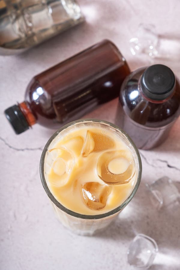 Cold Brew Coffee with Milk and Cold Brew Coffee in Bottles with Ice ...