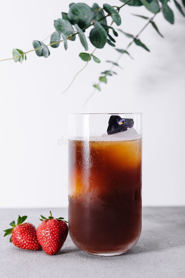 Cold Brew Coffee To Drink with Ice Cubes Decorated with Strawberry ...