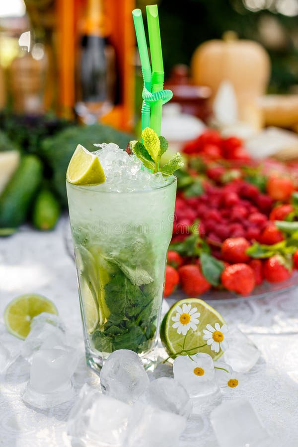 Cold Cocktail Mahito with Ice on a Decorated Table Stock Photo - Image ...