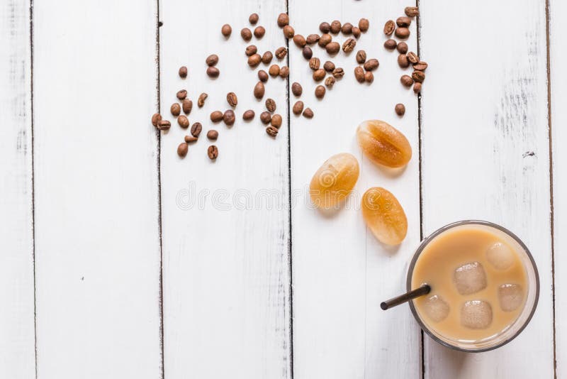 Cold Coffee Glass with Ice Cubes on White Table Background Top View ...
