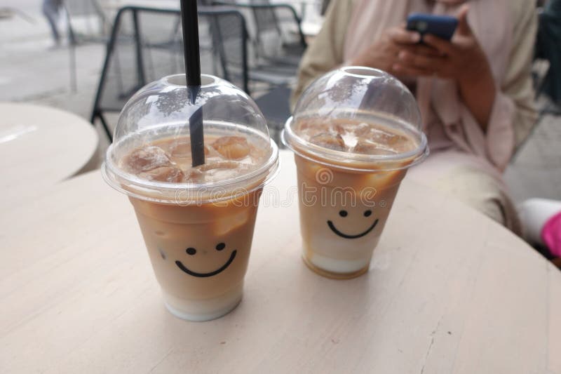 Cold Coffee in a Plastic Container with Smile Shape Design on it Stock ...