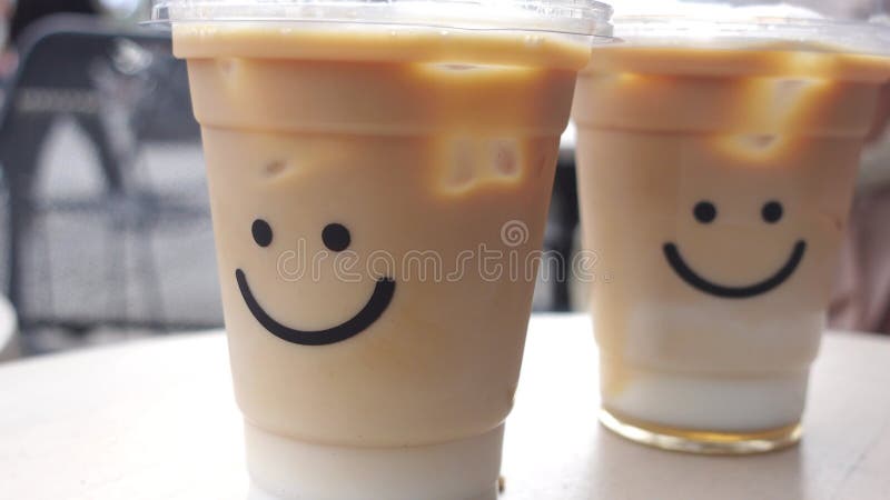 Cold Coffee in a Plastic Container with Smile Shape Design on it Stock ...