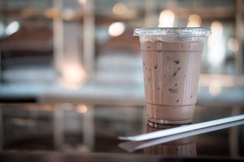 Cold coffee in plastic cup stock photo. Image of glass - 182673742