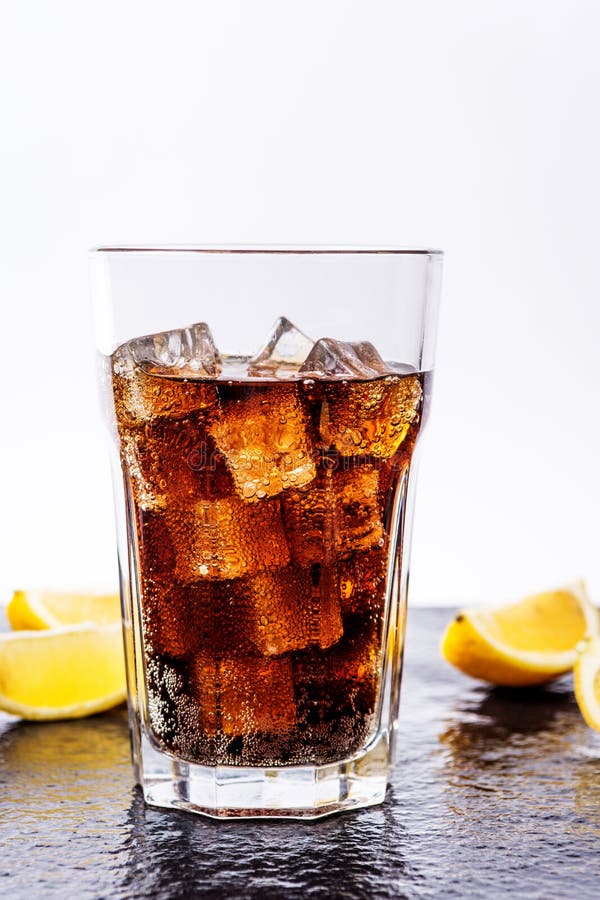 Cola with ice cubes stock photo. Image of juice, drink - 111345120